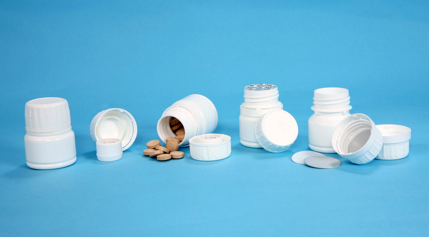 Moisture-sensitive bottle containers with silica desiccant capsules ...